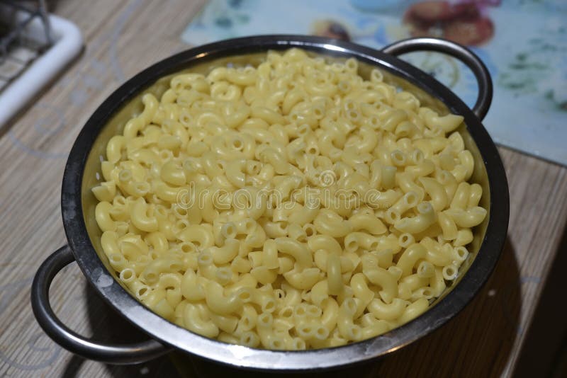 Boiled Pasta in a Colander. Yellow Pasta Close-up Stock Photo - Image ...