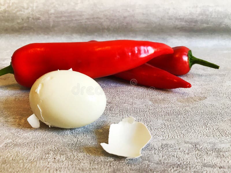Boiled, Peeled Egg and Fresh Red Pepper on the Table Stock Image ...