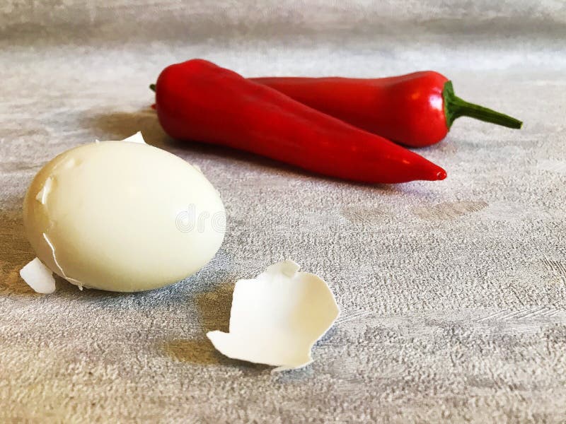 Boiled, Peeled Egg and Fresh Red Pepper on the Table Stock Image ...