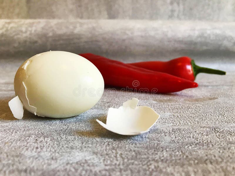 Boiled, Peeled Egg and Fresh Red Pepper on the Table Stock Photo ...
