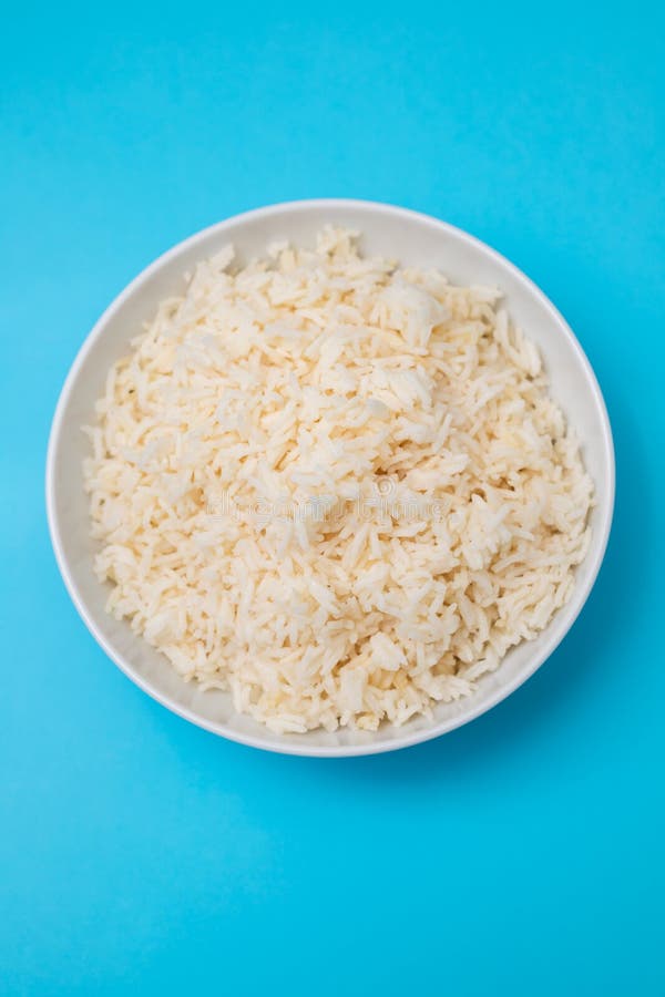 Boiled Rice in a Bowl on Blue Paper Stock Photo - Image of lunch ...