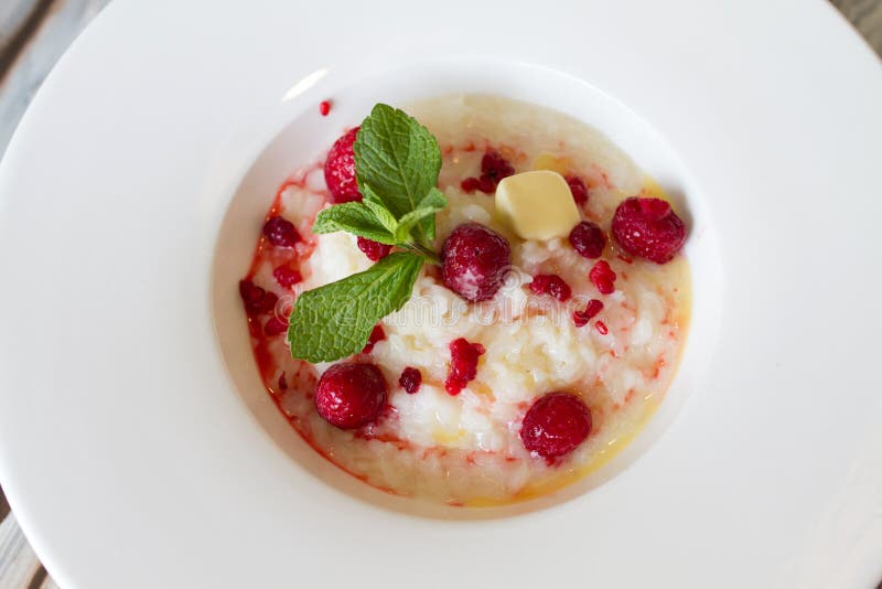 Boiled Rice with Raspberry in a Large Plate Stock Photo - Image of milk ...