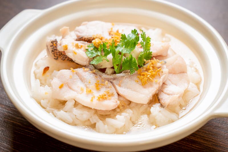 Boiled rice soup with fish stock photo. Image of culture - 192325382