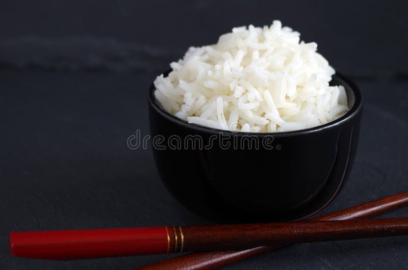 Boiled rice stock image. Image of cookery, chopsticks - 64678017
