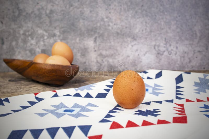 Boiled Standing Egg on a Ethnic Motifs Patterned Towel, Easter Backdrop ...