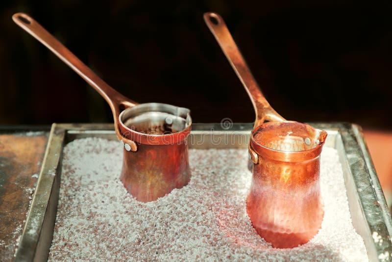 Boiled Traditional Turkish Coffee in the Pots on Sand. Stock Photo ...