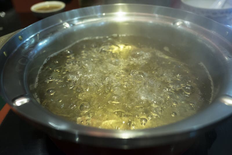 Boiled Water in Hot Pot. Boiled Water for Sukiyaki in Restaurant Stock ...