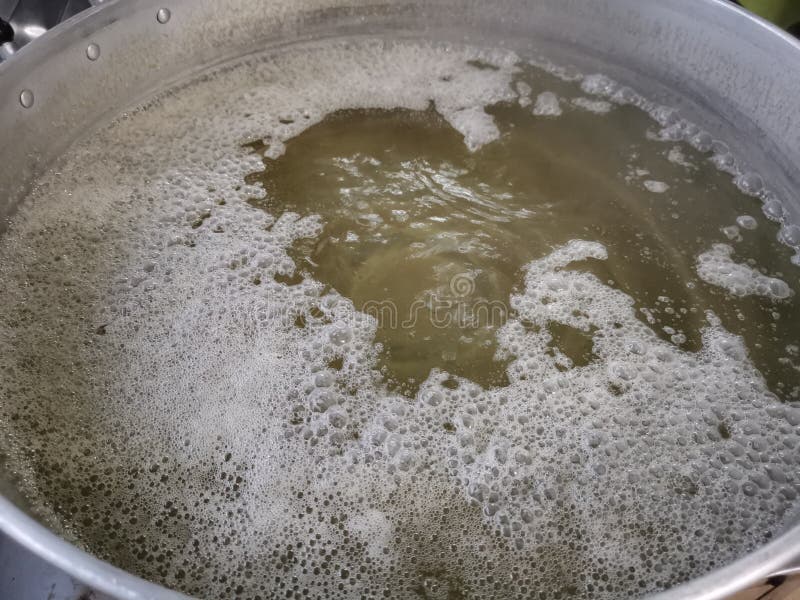 The Boiling Broth is Filled with White Bubbles Floating in a Large Pot ...