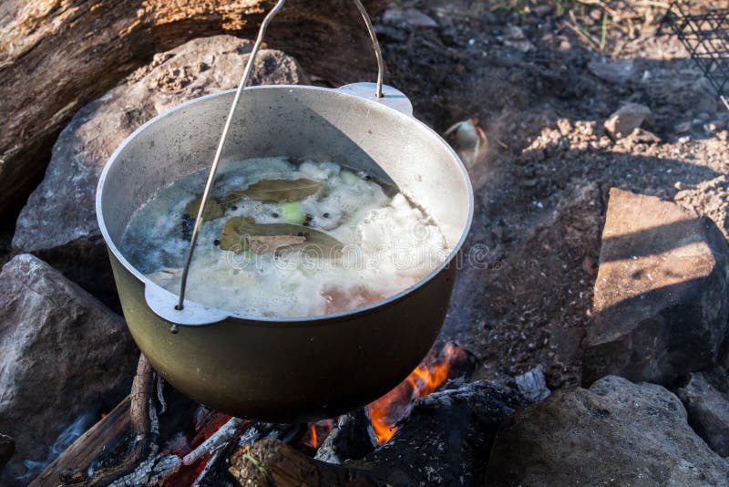 Boiling Cauldron Hangs Over an Open Fire Stock Photo - Image of ...