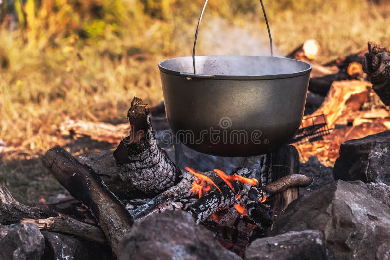 Boiling Cauldron is on an Open Fire Stock Image - Image of smoke ...