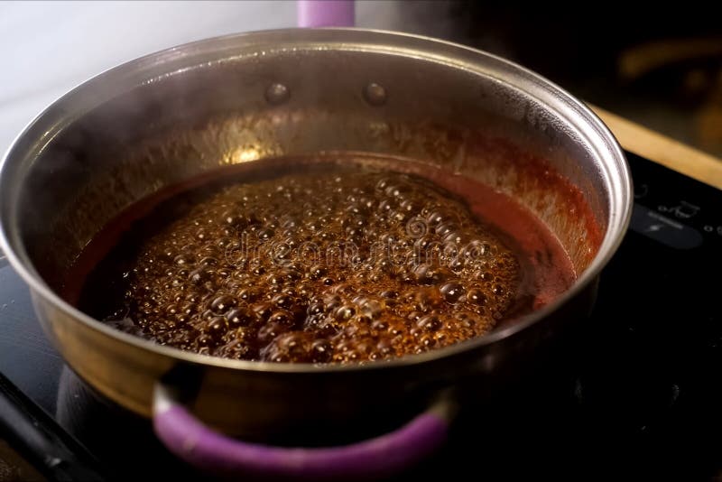 Boiling Jam, Jam To Jam. Boiling on Fire in Steel Plate Stock Image ...