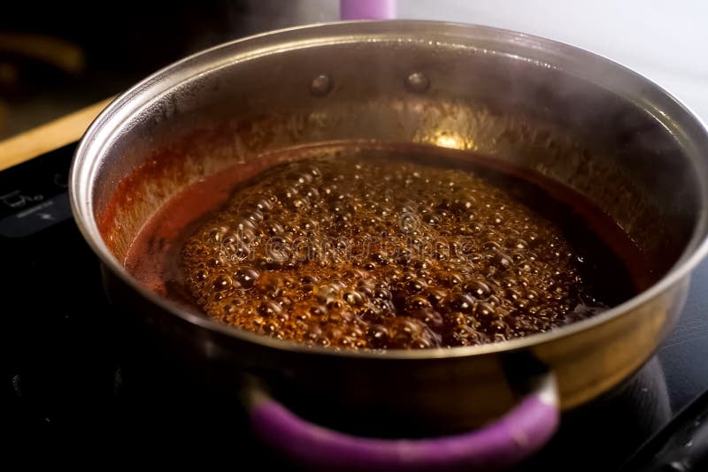 Boiling Jam, Jam To Jam. Boiling on Fire in Steel Plate Stock Image ...