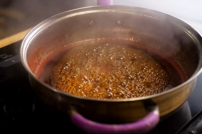 Boiling Jam, Jam To Jam. Boiling on Fire in Steel Plate Stock Image ...