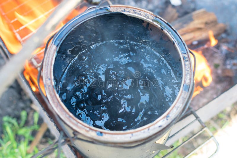 Boiling of Melted Black Tar on Fire with Bubbles and Steam Stock Photo ...