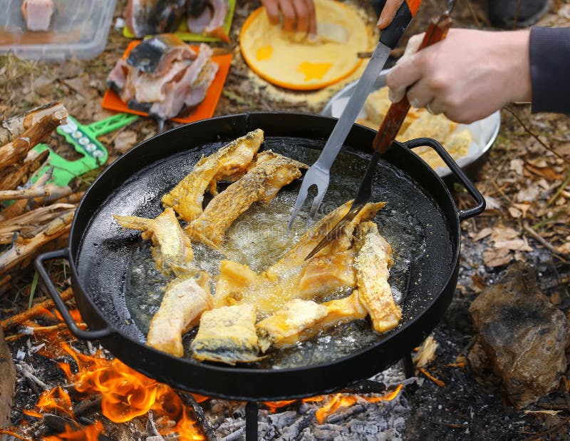Boiling in Oil on Opened Fire, Frying Fish Fillet. Stock Photo - Image ...