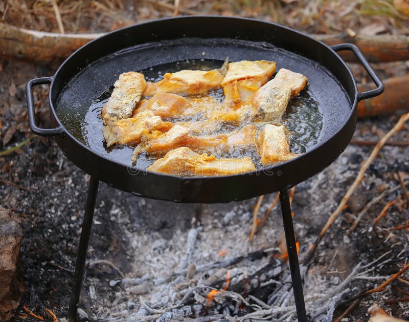 Boiling in Oil on Opened Fire, Frying Fish Fillet. Stock Photo - Image ...
