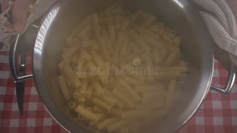 Boiling pasta in water stock footage. Video of nutrition - 276827440