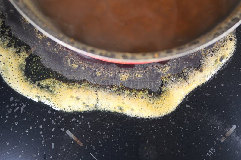 A Boiling Pot with Spilled Stains on the Kitchen Stove Area Stock Image ...