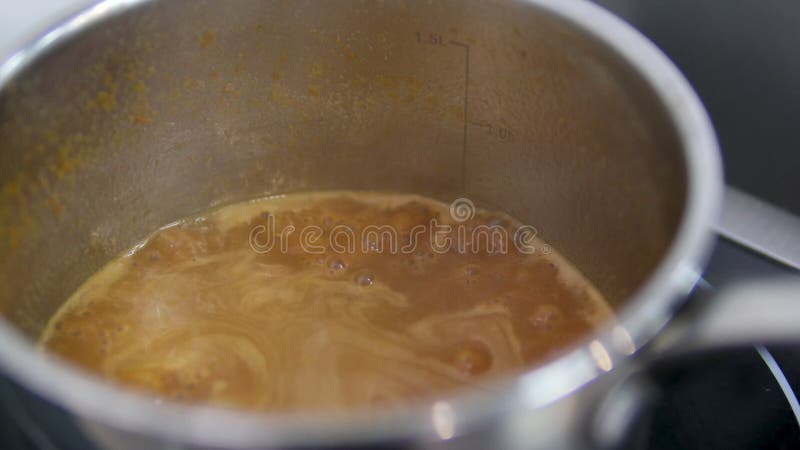 Boiling Sugar with Bubbles Turns into Caramel, Caramelization. Macro ...