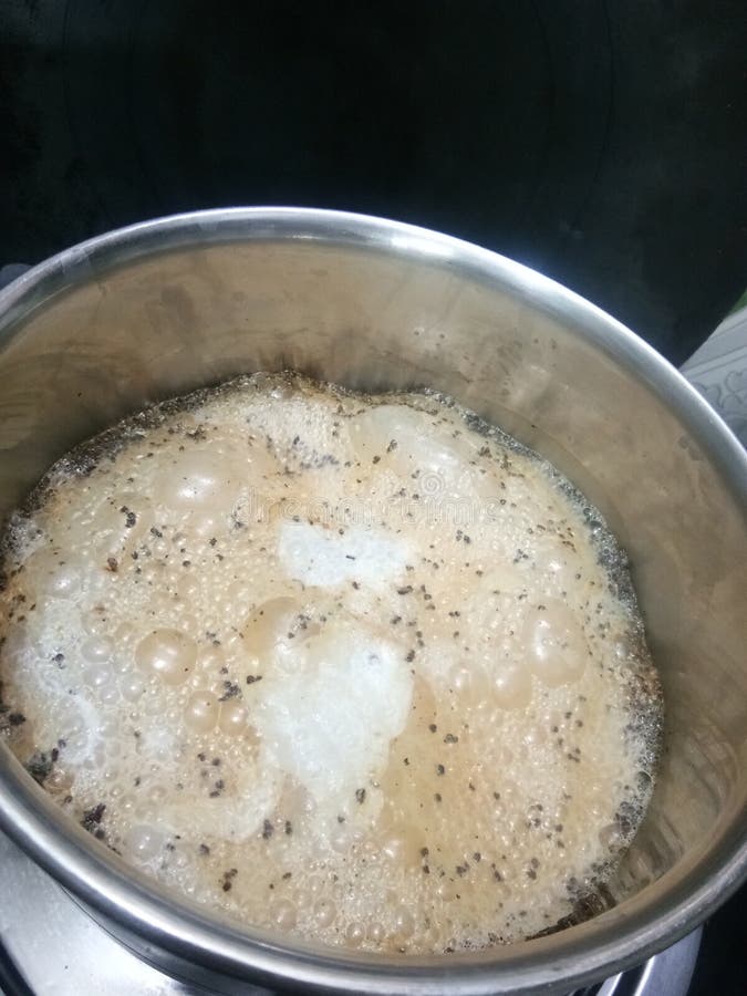 Boiling milk tea in a pan stock photo. Image of meat - 227923342