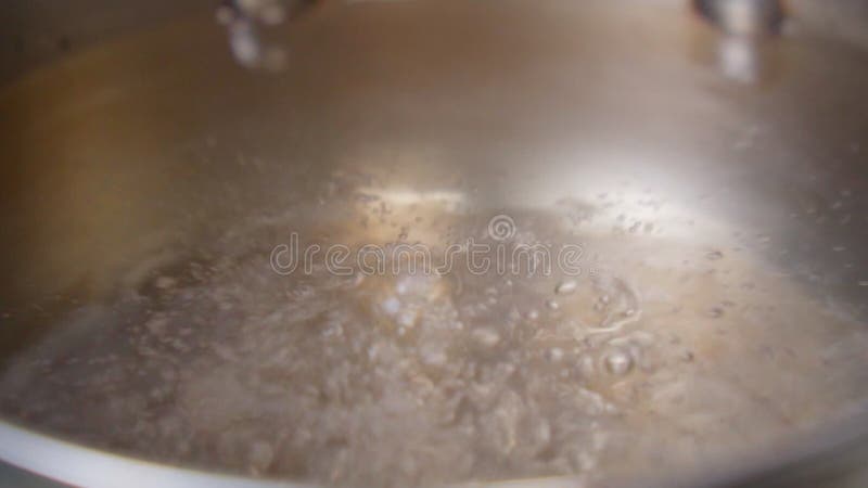 Process of Boiling Water, Close-up. Bubbles of Boiling Water in a Steel ...