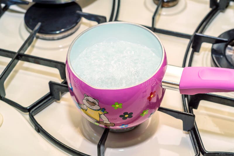 Boiling water in pan stock photo. Image of orange, liquid - 90564584
