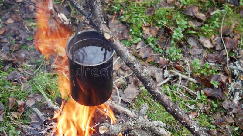 Boiling Water in Pots Above the Fire in Outdoor Stock Video - Video of ...