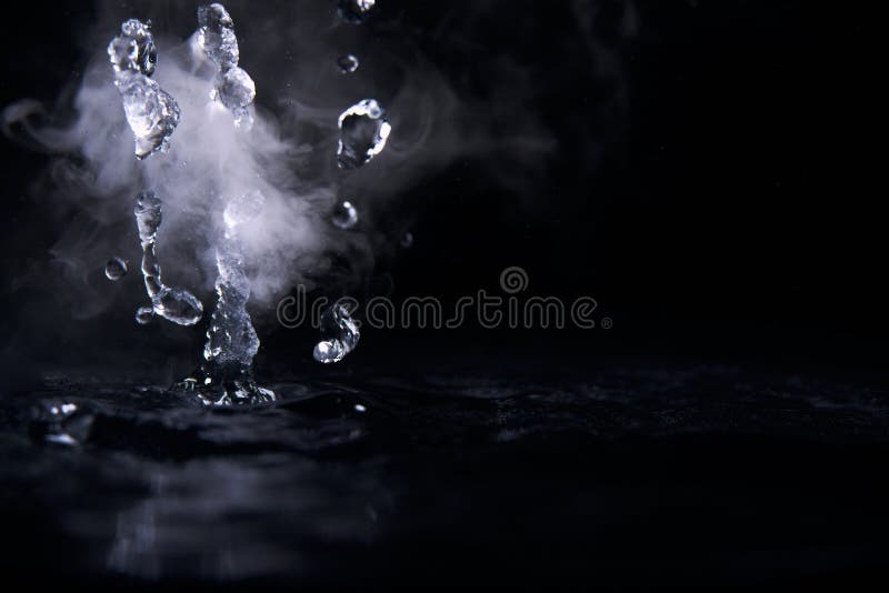 Boiling Water Splash with Steam on Black Background Closeup Stock Image ...