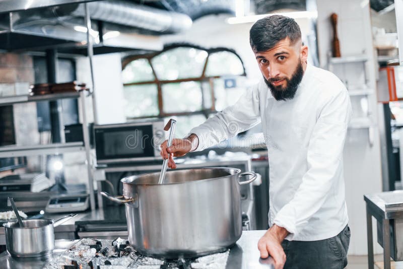 Boils Water. Chef in White Uniform Cooking Food at Kitchen Stock Photo ...