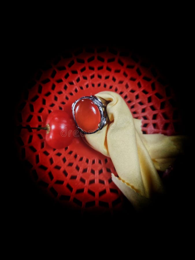 Bold Beauty Centered: Indonesian Gold Ring with Ruby, Framed by Vibrant Red and Golden Elegance ...