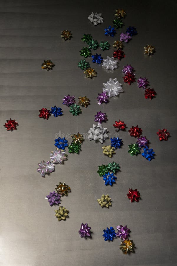 Bold Bright Colored Wrapping Paper Stars Forming Patterns on a Shiny ...