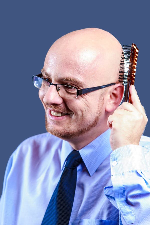 Strong Looking Bold Man Sitting On A Chair Looking To The Viewer Stock ...