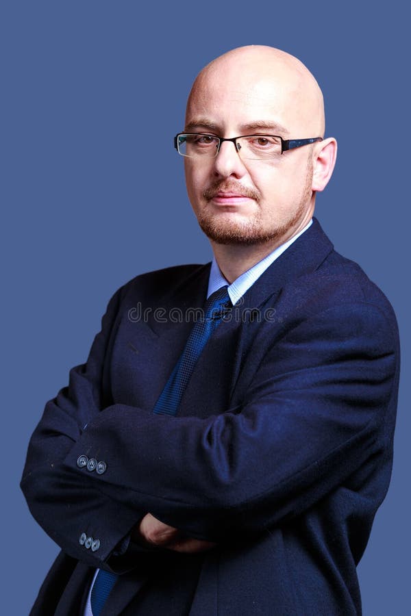 Strong Looking Bold Man Sitting on a Chair Looking To the Viewer Stock ...