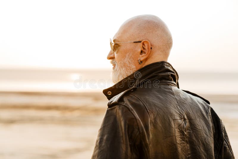 Bold Senior Man in Leather Jacket Looking Aside Outdoors Stock Photo ...