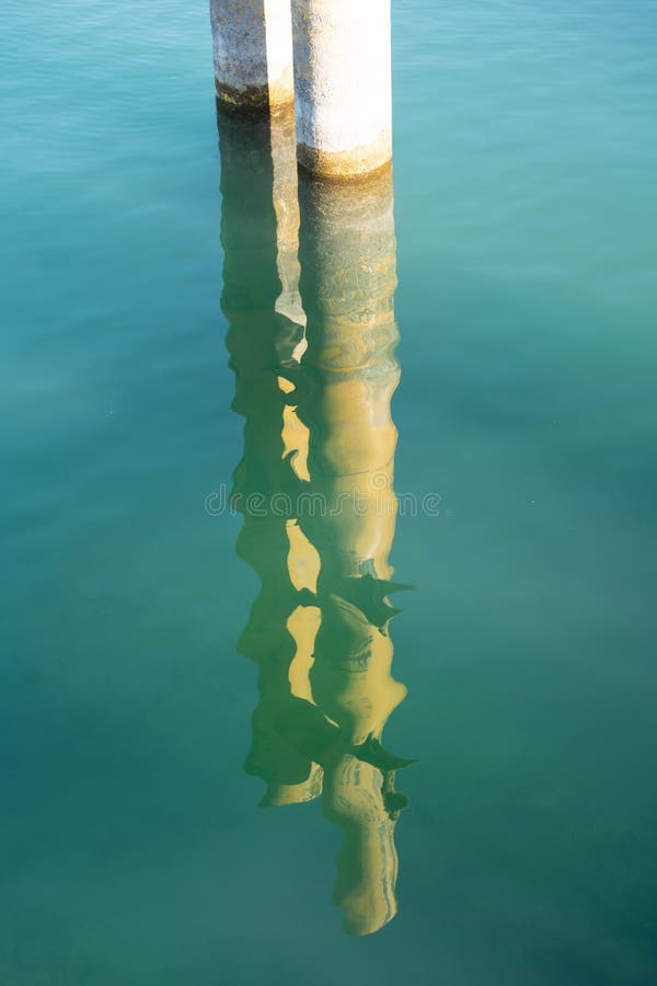 Bollard in the water stock photo. Image of post, ocean - 158999822