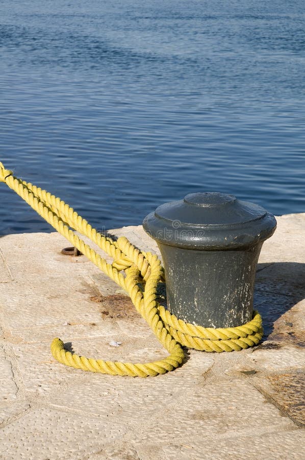 Bollard with yellow rope stock image. Image of crew, dock - 58634027