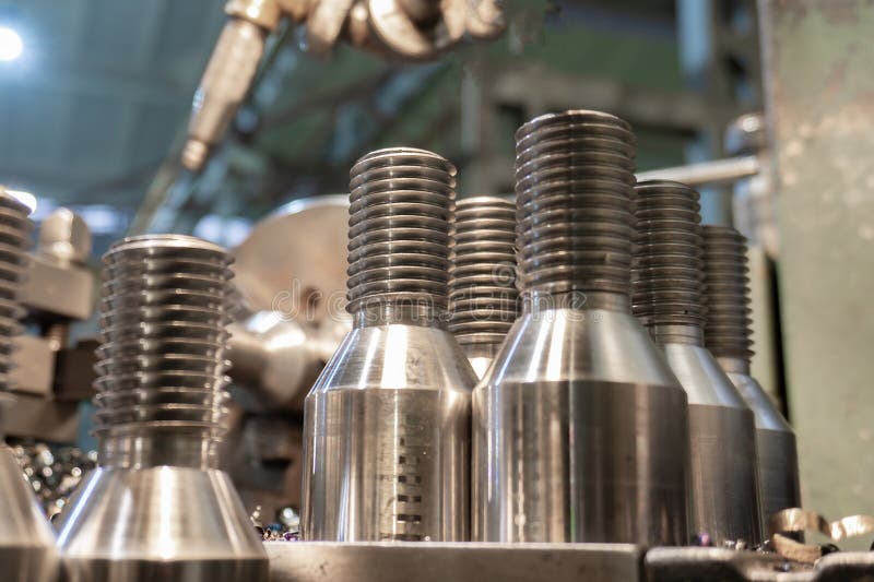 Bolt Threading on a Lathe in a Machine Shop, Finished Products on a ...