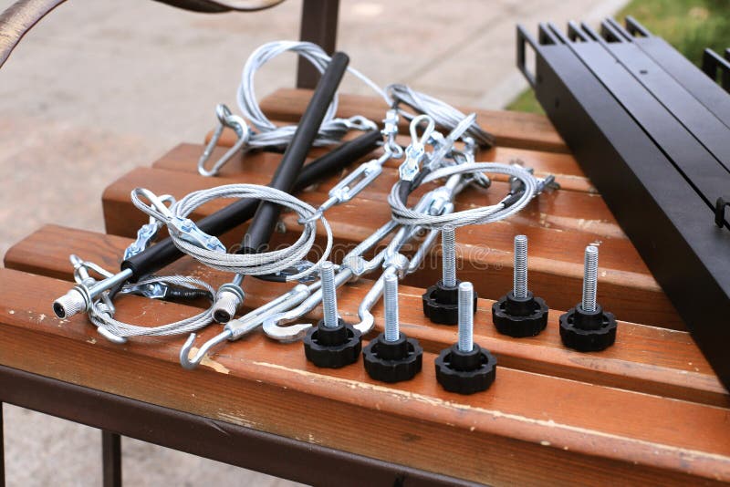 Bolts, Fastening, Rope Lying on a Wooden Bench Stock Image - Image of ...