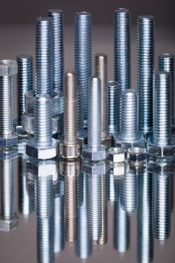Bolts and Nuts on a Mirror Background. Stock Photo - Image of alloy ...
