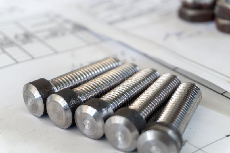 Bolts After Turning With Thread On The Background Of Technical Drawings ...