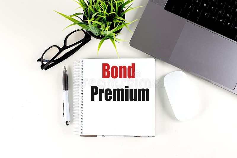 BOND PREMIUM Text on Notebook with Laptop, Mouse and Pen Stock Image ...