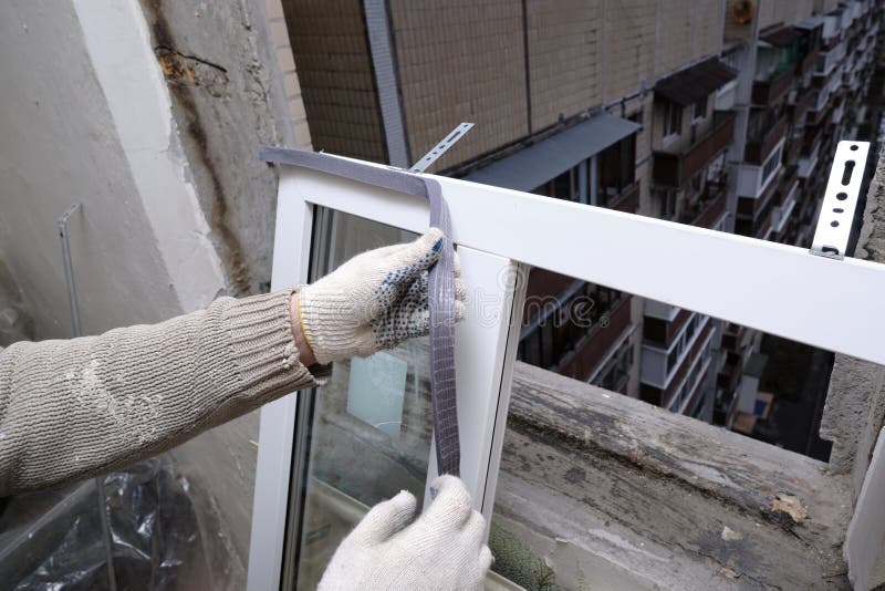 Bonding Insulating Tape To a Plastic Window during Installation Stock ...