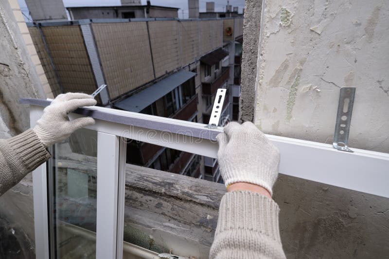 Bonding Insulating Tape To a Plastic Window during Installation Stock ...