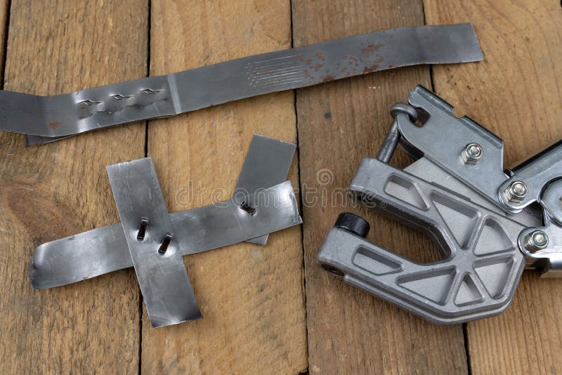 Bonding a Sheet Metal Using a Crimper. Small Locksmith Works in Stock ...