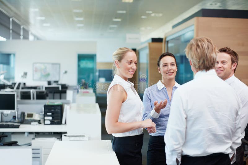 Bonding at Work. Business Coworkers Standing Together and Chatting ...