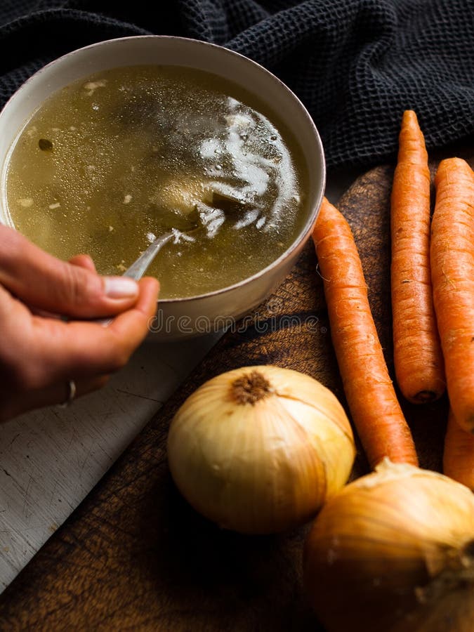 Bone Broth with Ingredients on Rustic Table. Natural Light Stock Photo ...