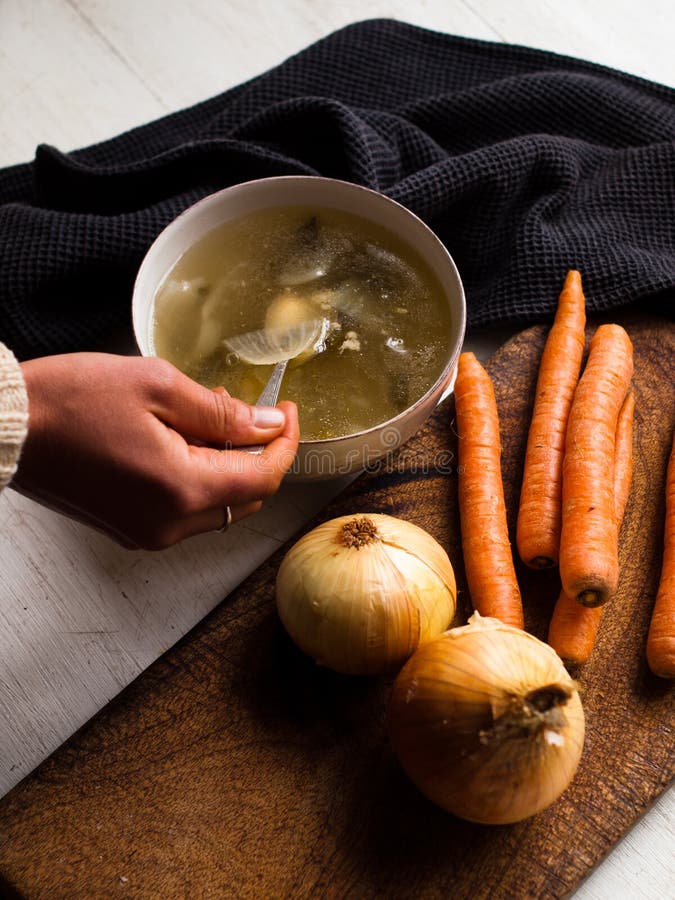 Bone Broth with Ingredients on Rustic Table. Natural Light Stock Photo ...