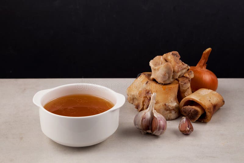 Bone Broth in White Bowl on Dark Background. Selective Focus, Copy ...