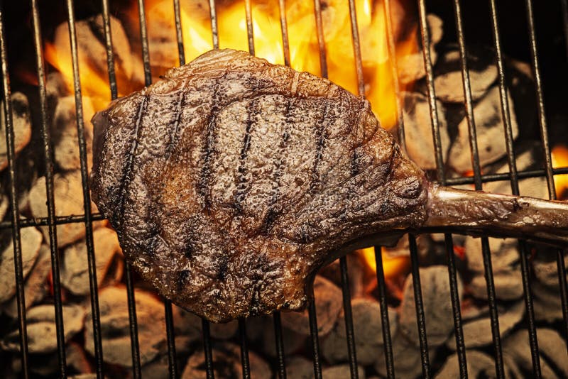 Bone-in Tomahawk Ribeye Steak on Grill Overhead Stock Image - Image of ...