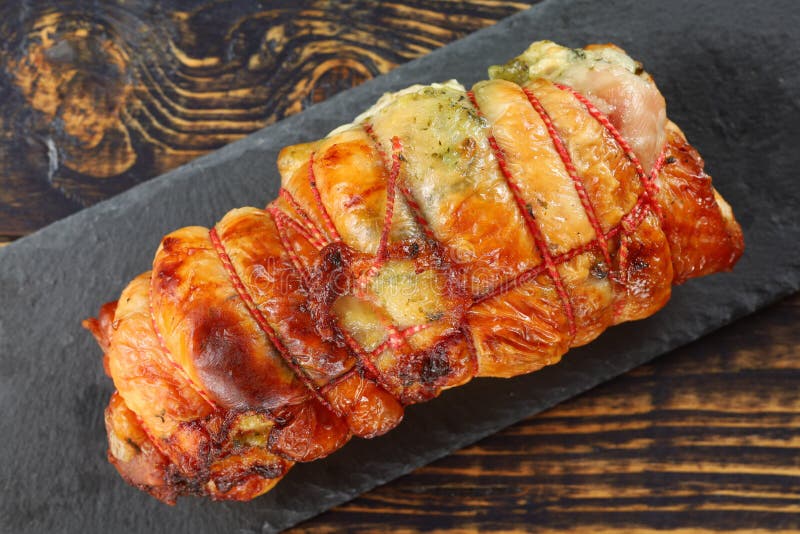 Boneless Meat Roulade on a Dark Wooden Table. Meat Roll Close-up Stock ...